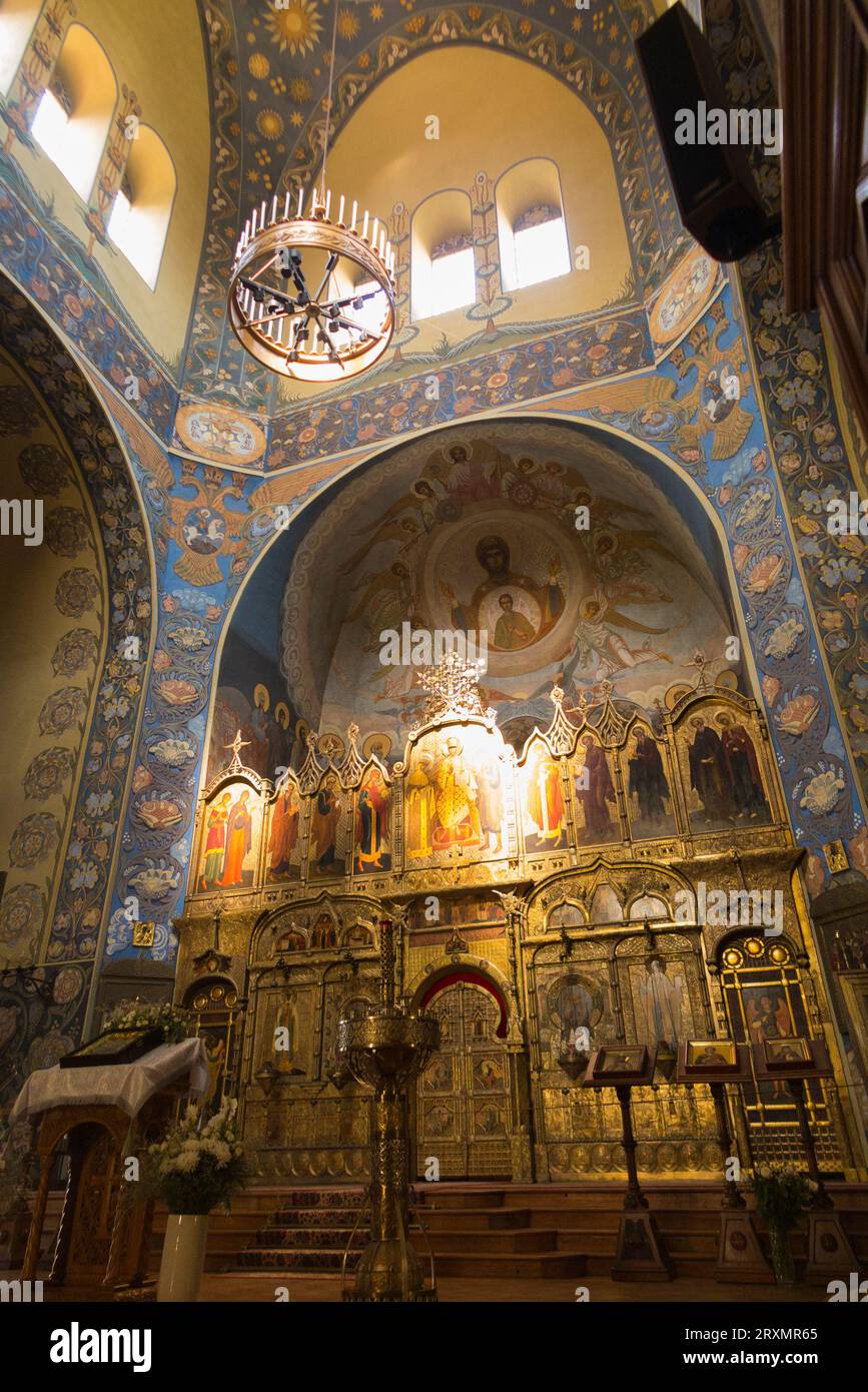 Looking up at images and paintings on the vaults of the altar apse at ...