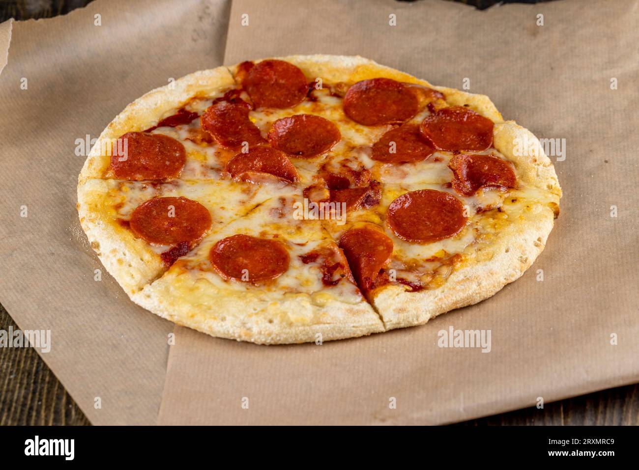 small homemade spicy pizza with sausage and cheese, chilled pizza of ...