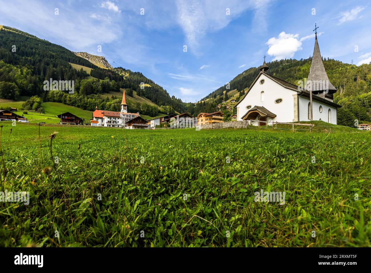 Jaun in the canton of Fribourg. The old church in the foreground ...