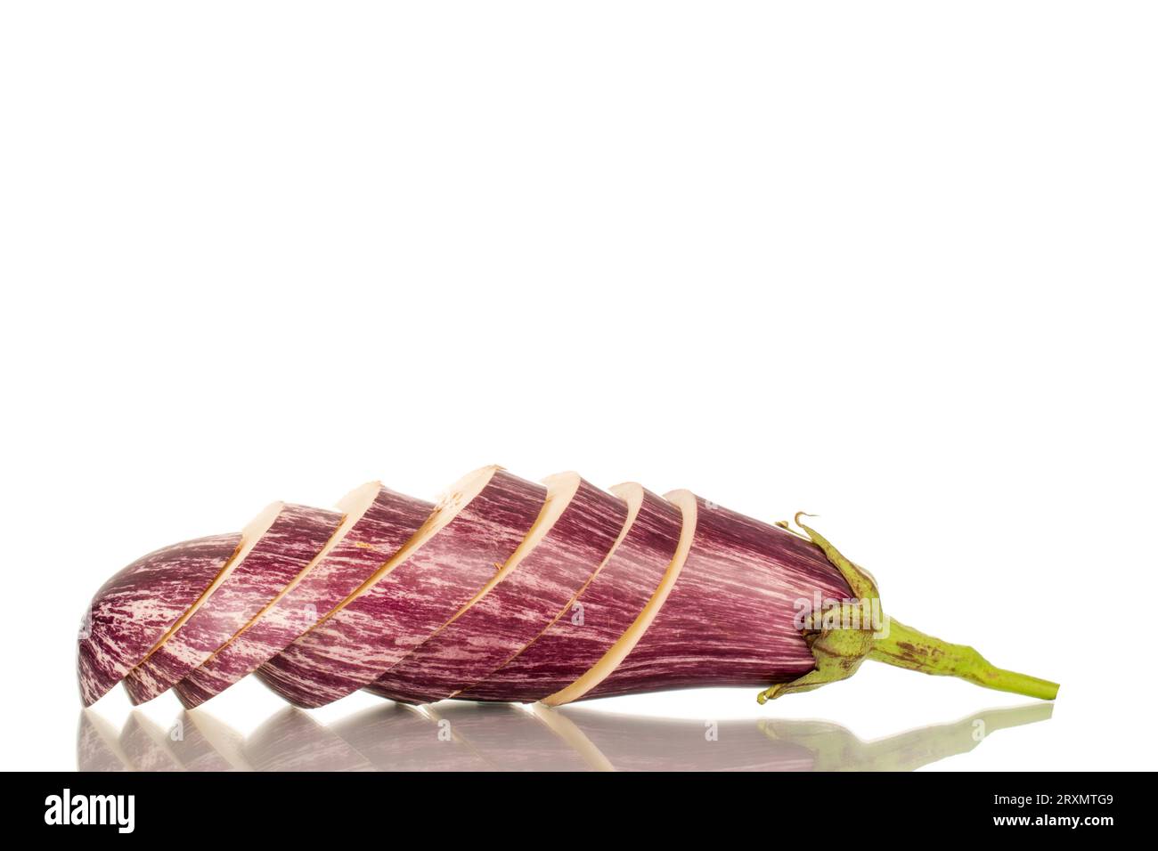 One juicy eggplant cut into pieces, macro, isolated on white background ...