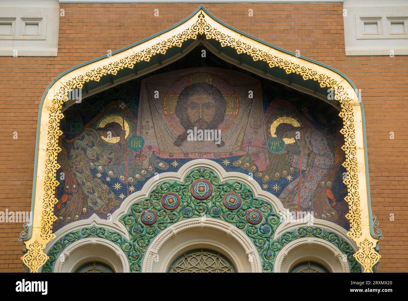Mosaic picture and surrounding ceramic frieze decoration on exterior ...
