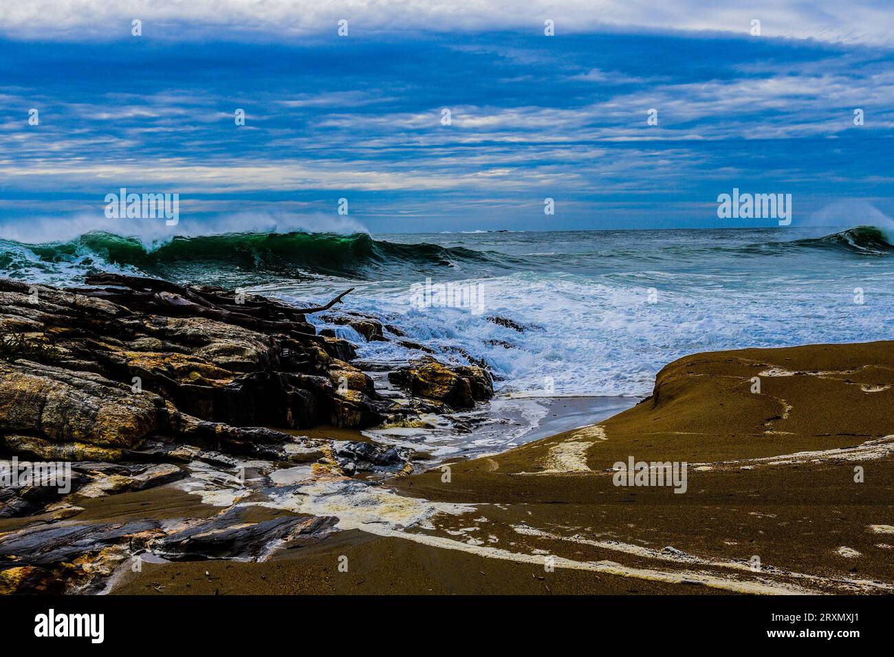 surge before the offshore storm and flood a beach with foam Stock Photo ...