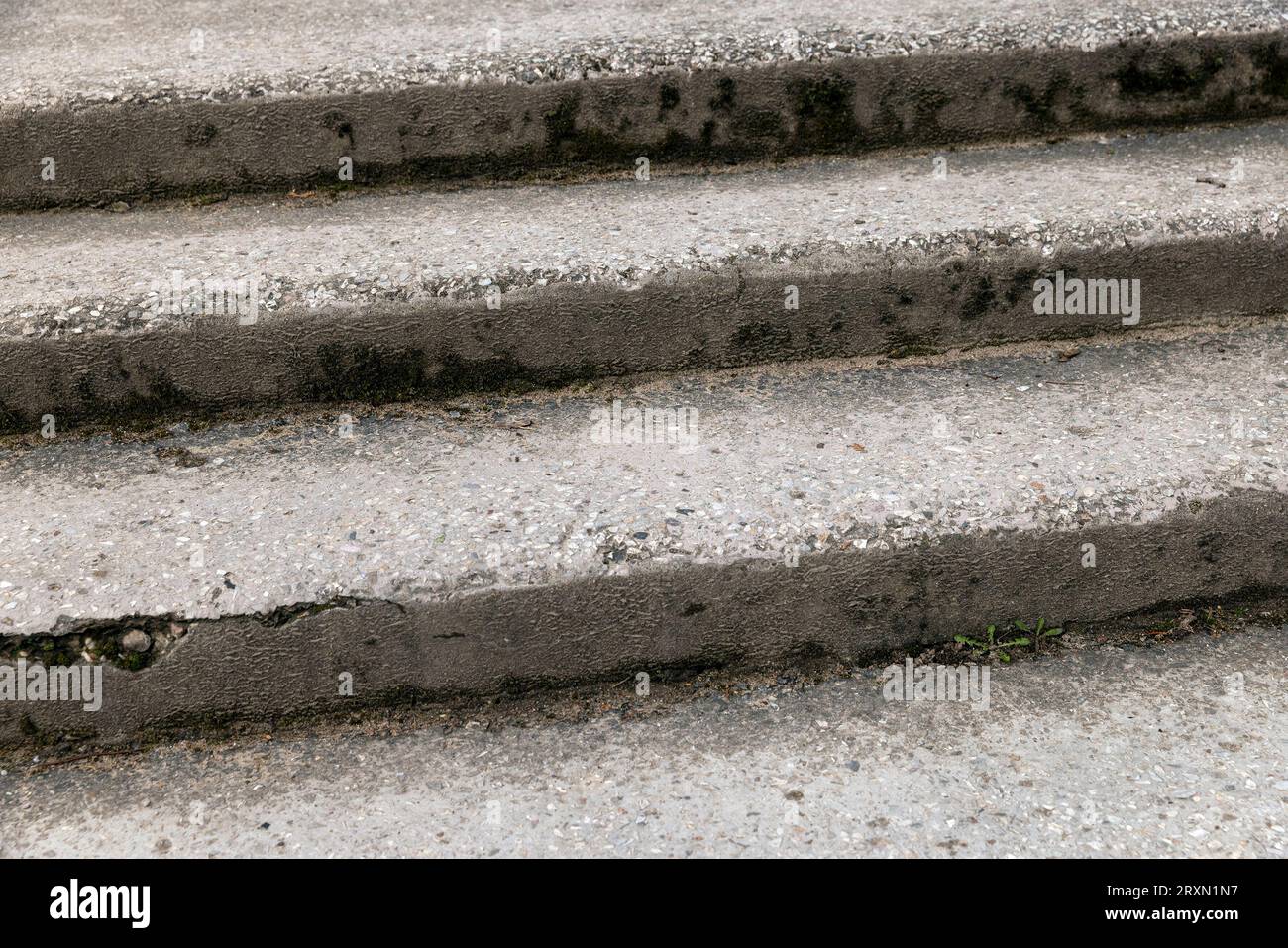 an old ruined concrete and stone staircase in the park, the details of ...