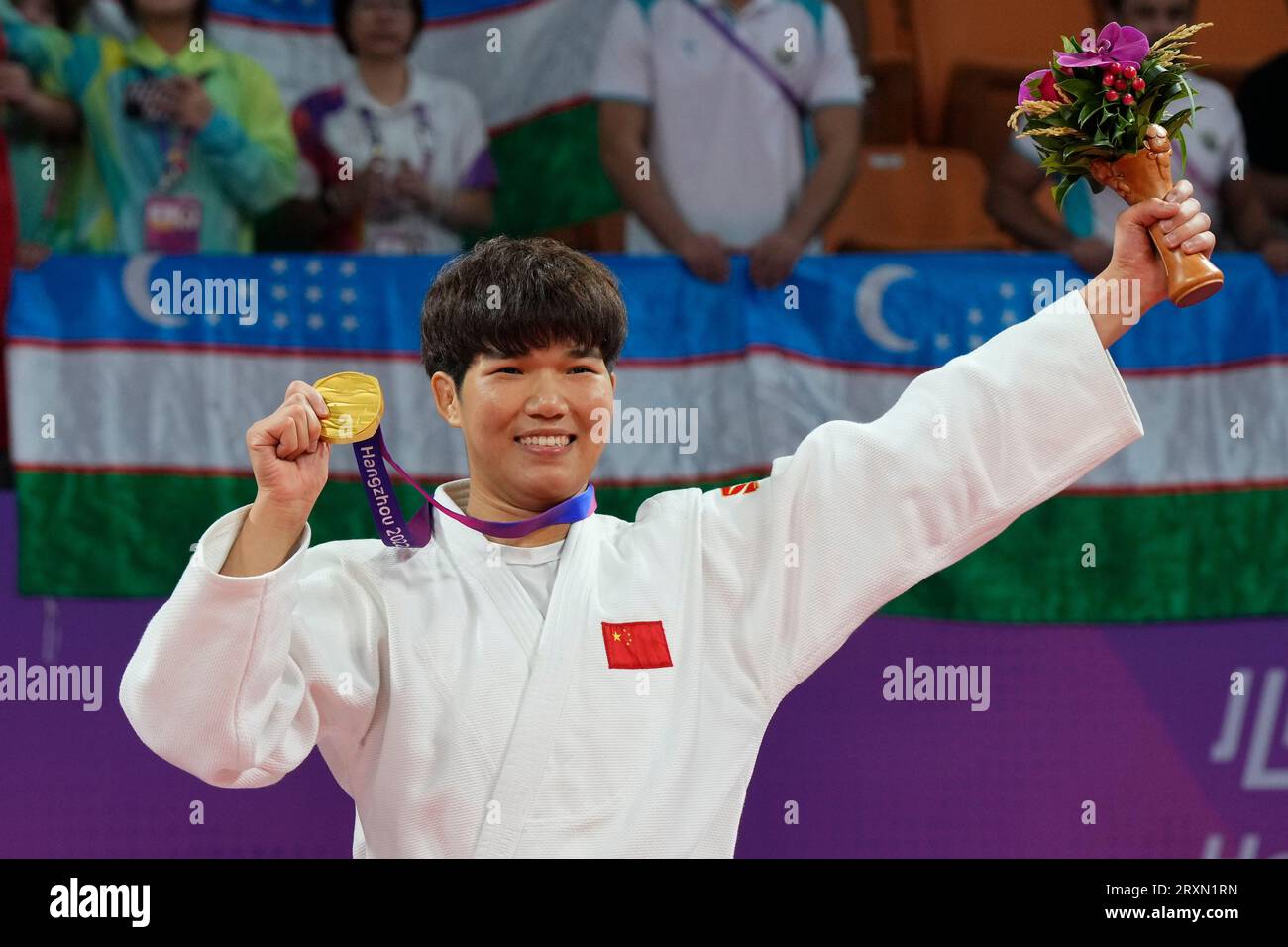 Gold Medalist, China's Ma Zhenzhao poses on the podium at the medal ...
