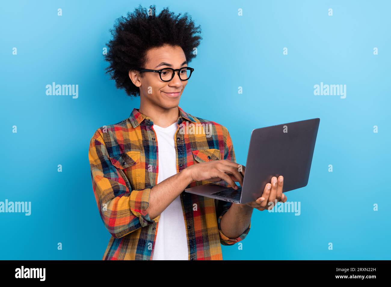 Portrait of intelligent cheerful guy with afro hairstyle touch glasses ...
