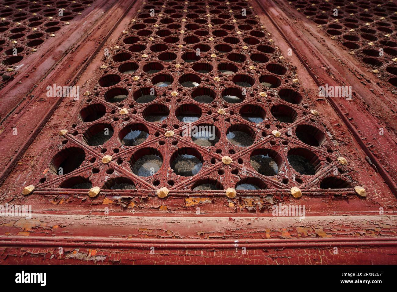 The red wooden window lattice architecture is located in the Eastern ...