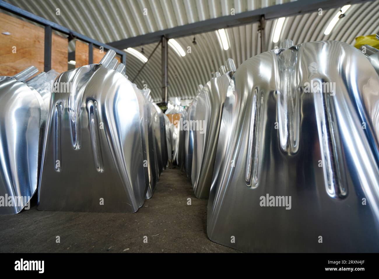Steel shovel pieces are stacked together on a hardware tool ...