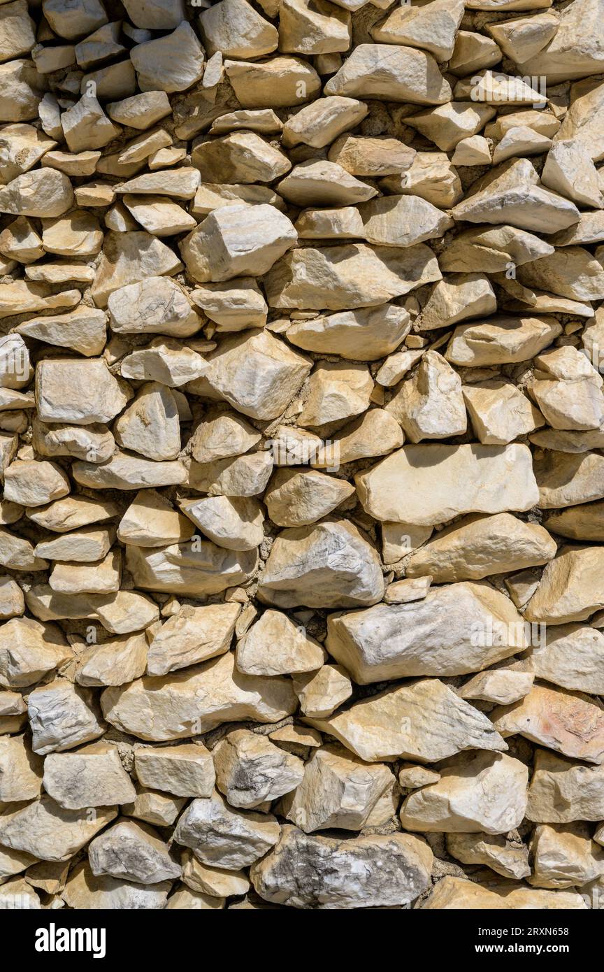 Stacked stone wall giving an abstract design Stock Photo - Alamy