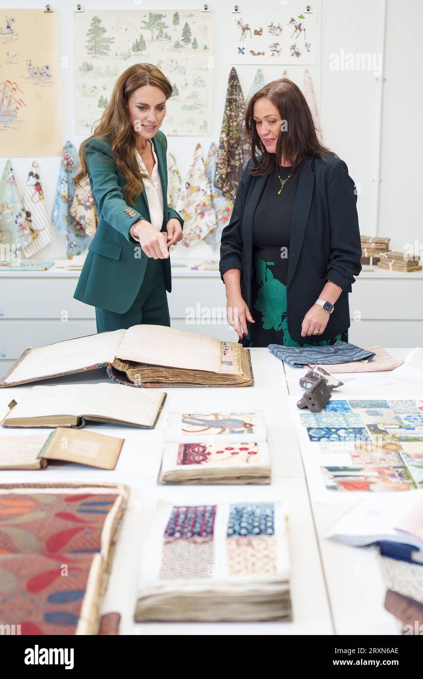 The Princess of Wales (left) views items from the archives with ...