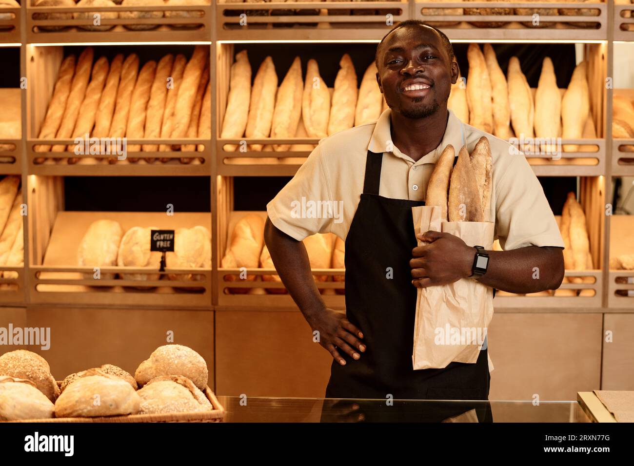 Behind counter black uniform hi-res stock photography and images - Alamy