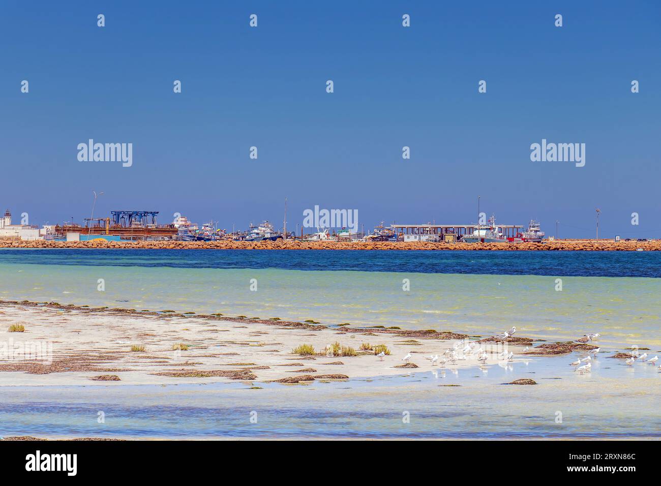 Fishing Port on Two-Tone Beach Stock Photo - Alamy