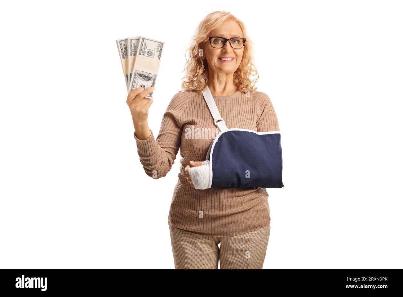 Woman with a broken arm in a sling holding stacks of money isolated on ...