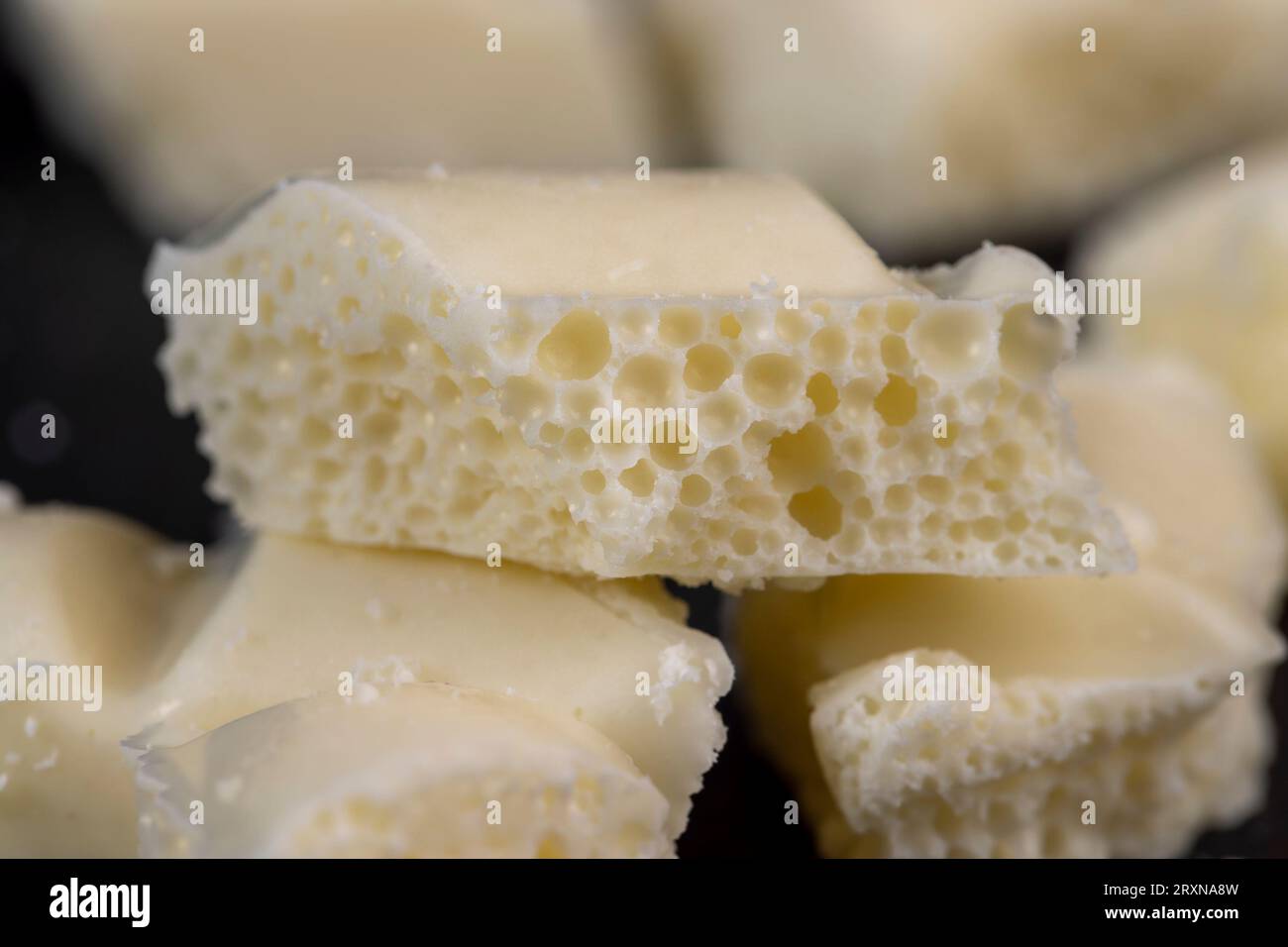 White Chocolate Bar with bubbles close-up, sweet chocolate with cocoa ...