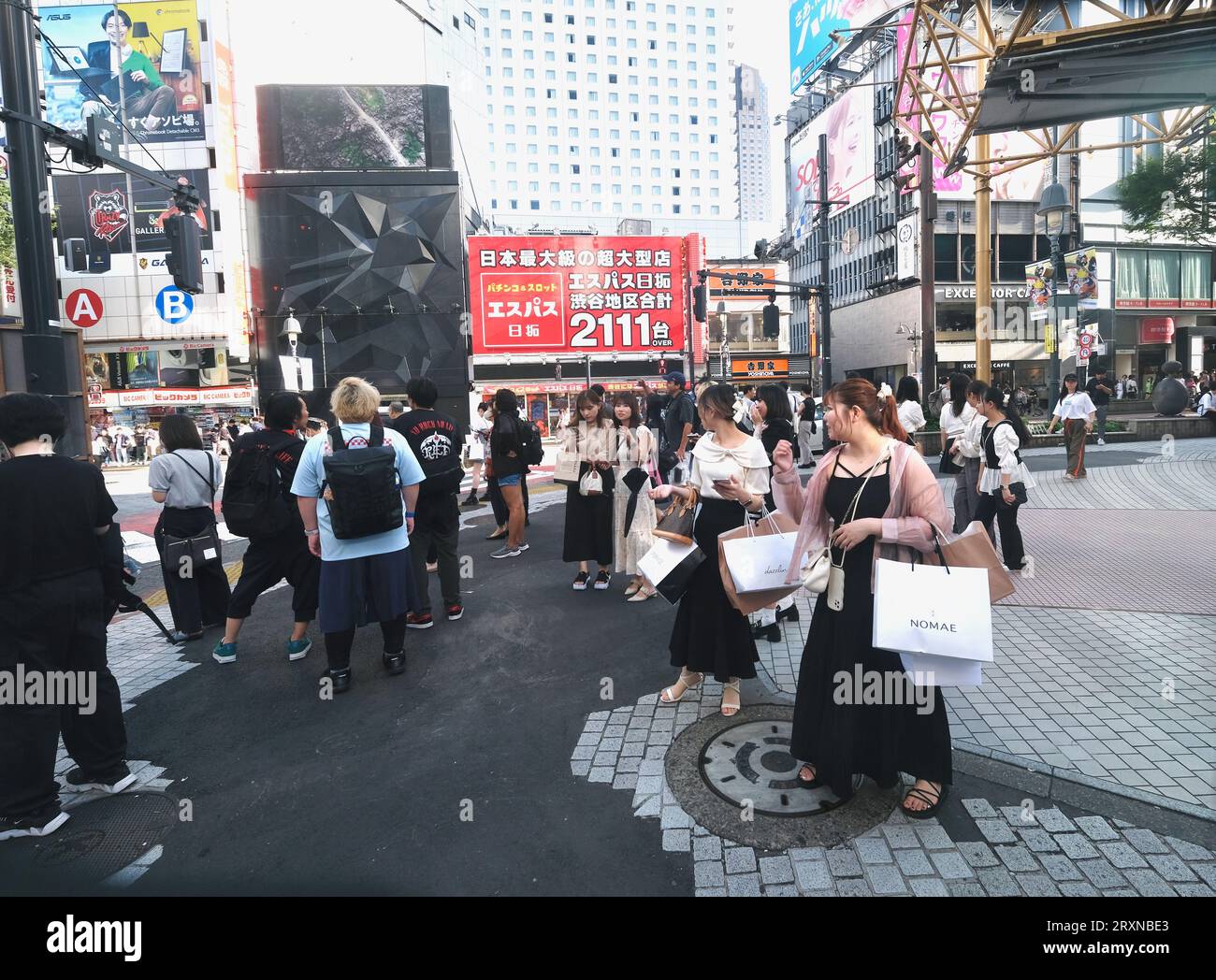 Shoppers mingle in Shibuya, Tokyo, Japan Stock Photo - Alamy