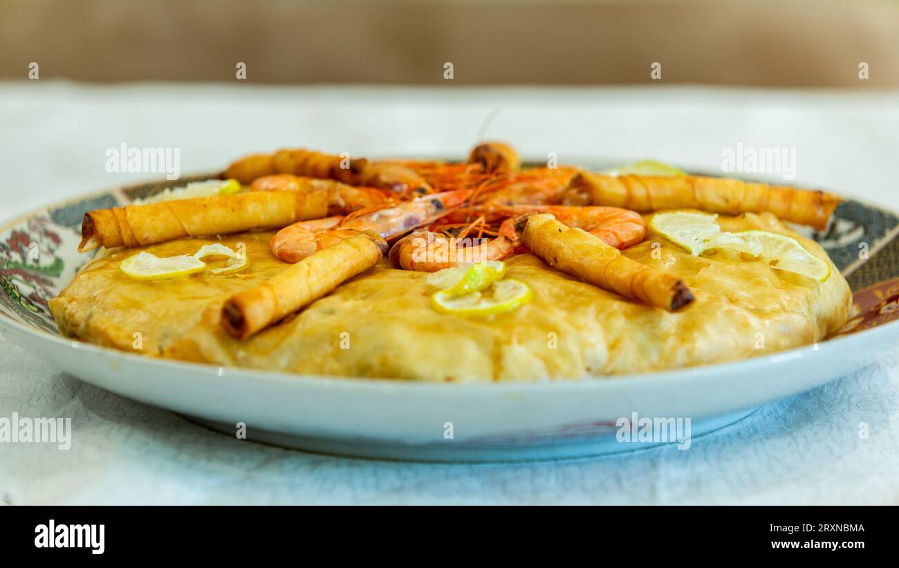 Traditional Moroccan pastilla with different seafood Stock Photo - Alamy