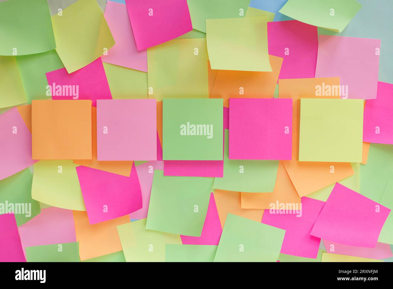 Five colored paper stickers for writing in a row against a background ...