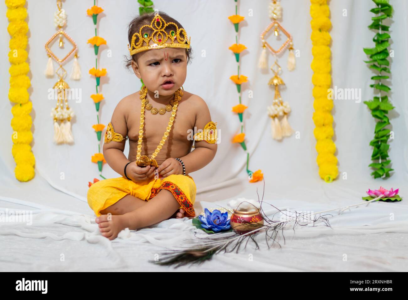 adorable infant dressed as hindu god krishna on the occasion of ...