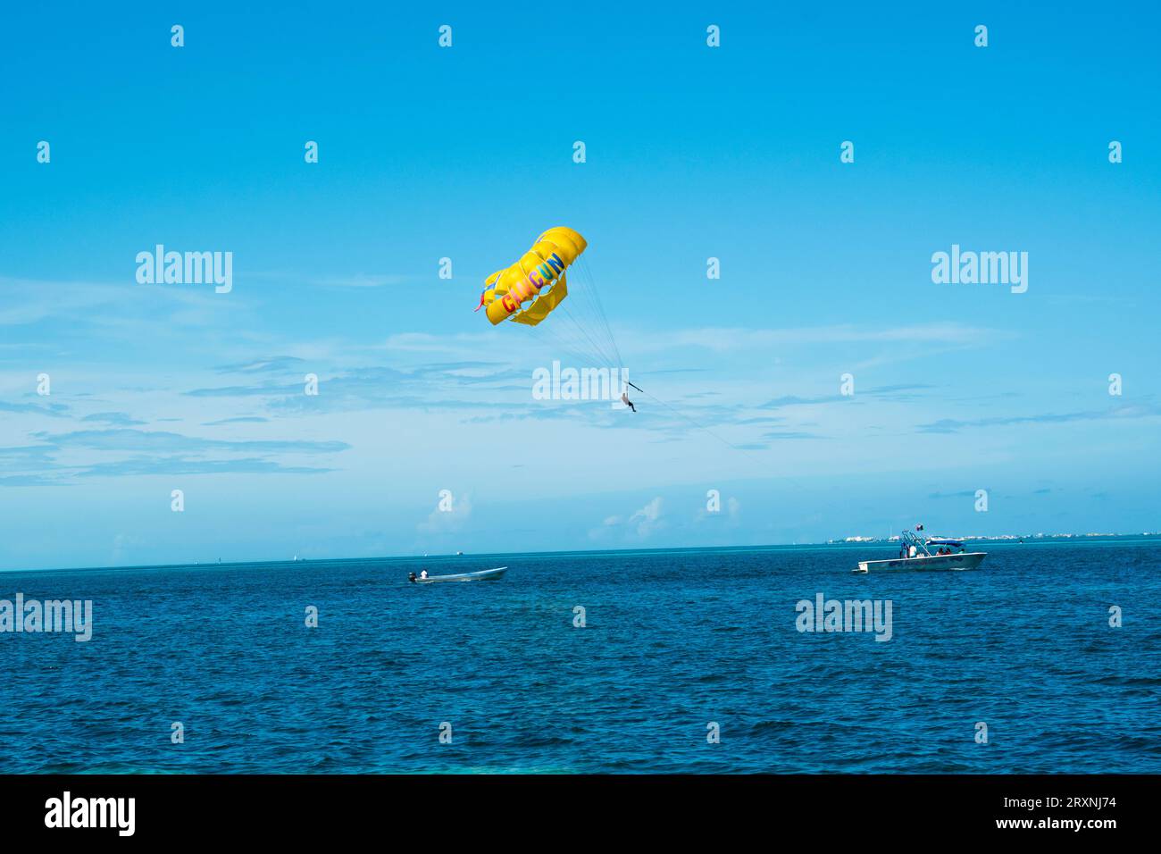 Paragliding sailing while vacationing in Cancun, Mexico Stock Photo - Alamy