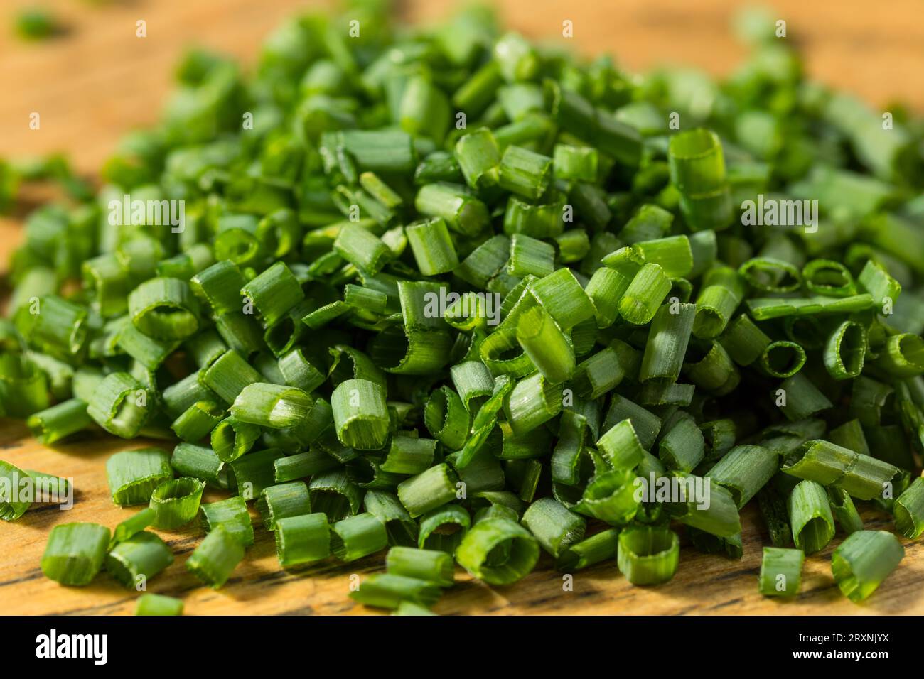 Organic Raw Green Chopped Chives on a Cutting Board Stock Photo - Alamy