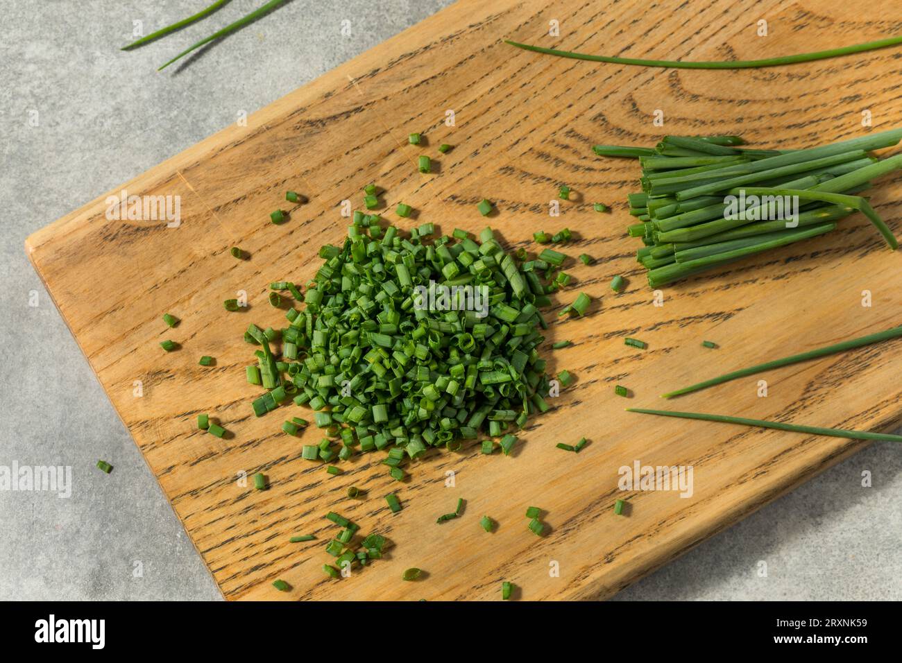 Organic Raw Green Chopped Chives on a Cutting Board Stock Photo - Alamy