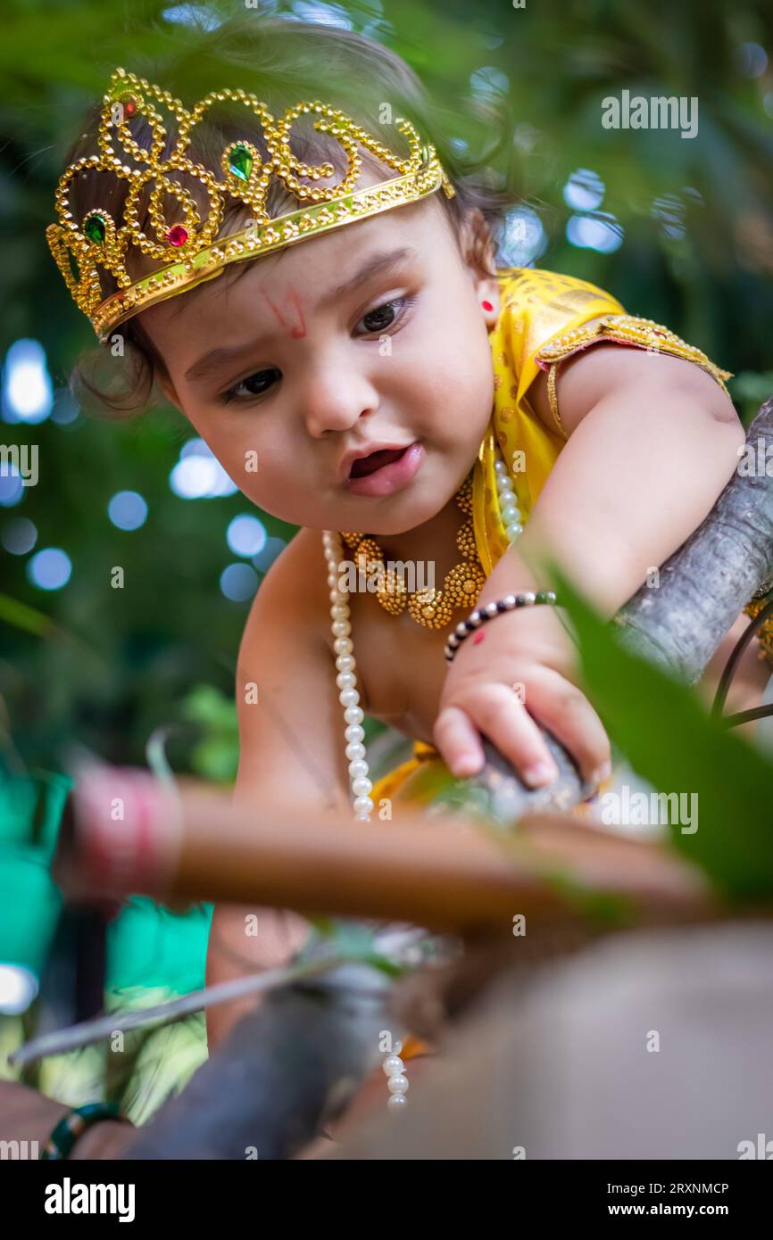 adorable infant dressed as hindu god krishna cute facial expression ...