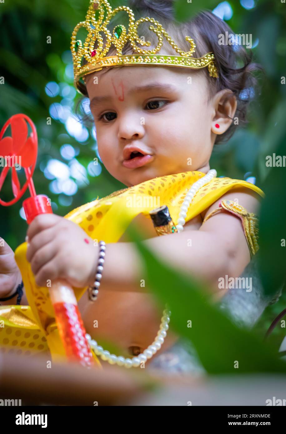 adorable infant dressed as hindu god krishna cute facial expression ...