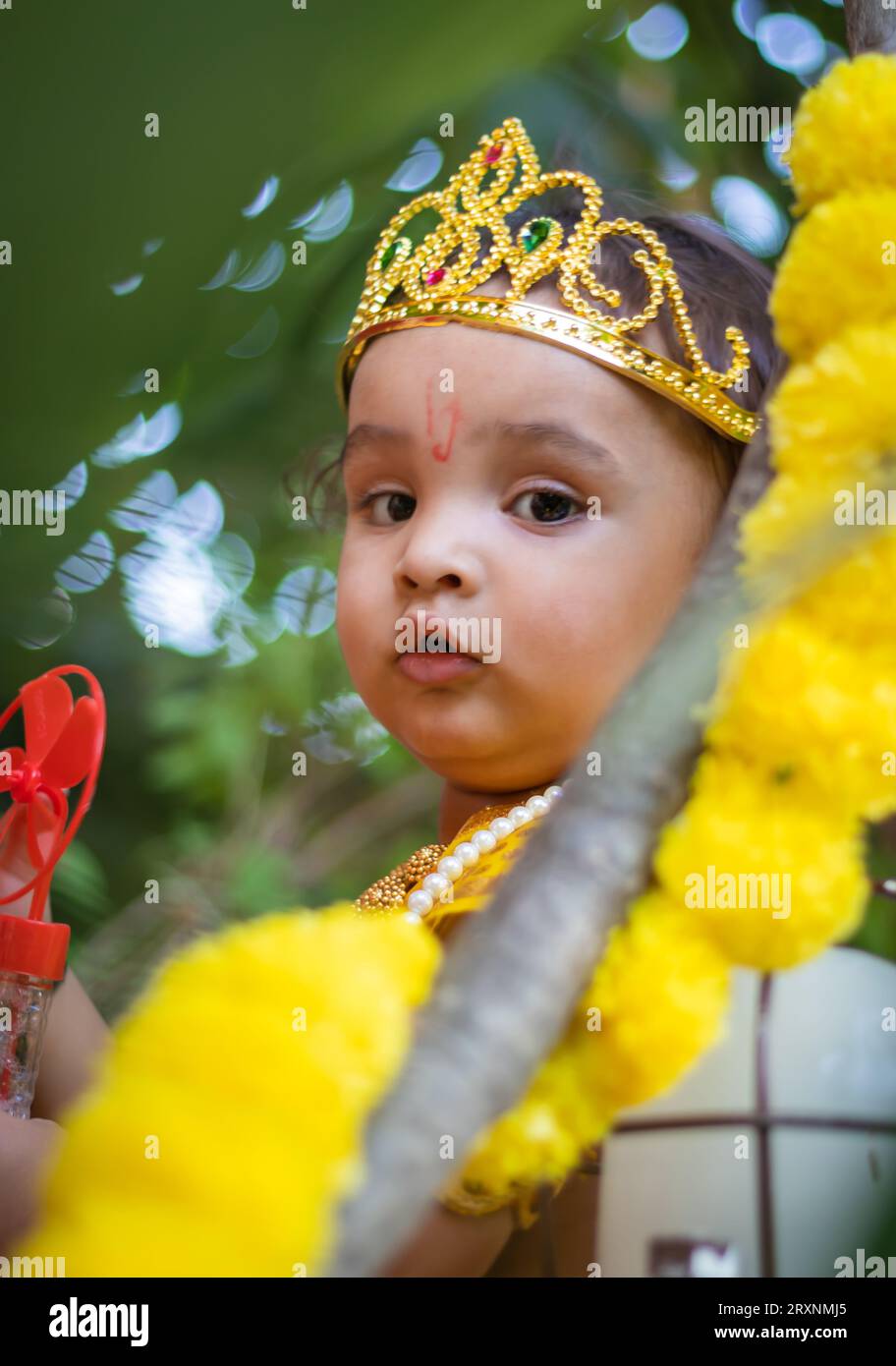 adorable infant dressed as hindu god krishna cute facial expression ...