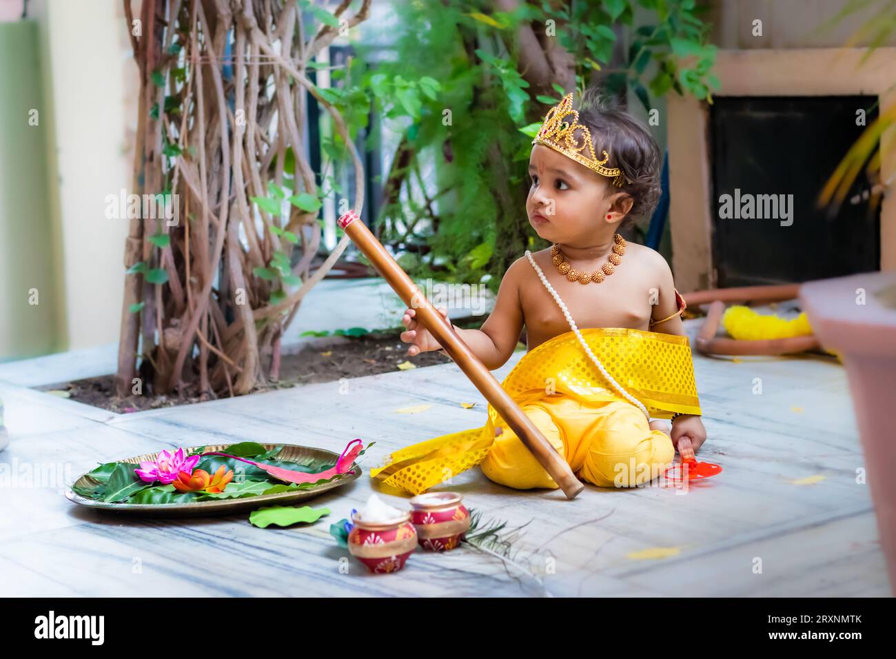 adorable infant dressed as hindu god krishna cute facial expression ...