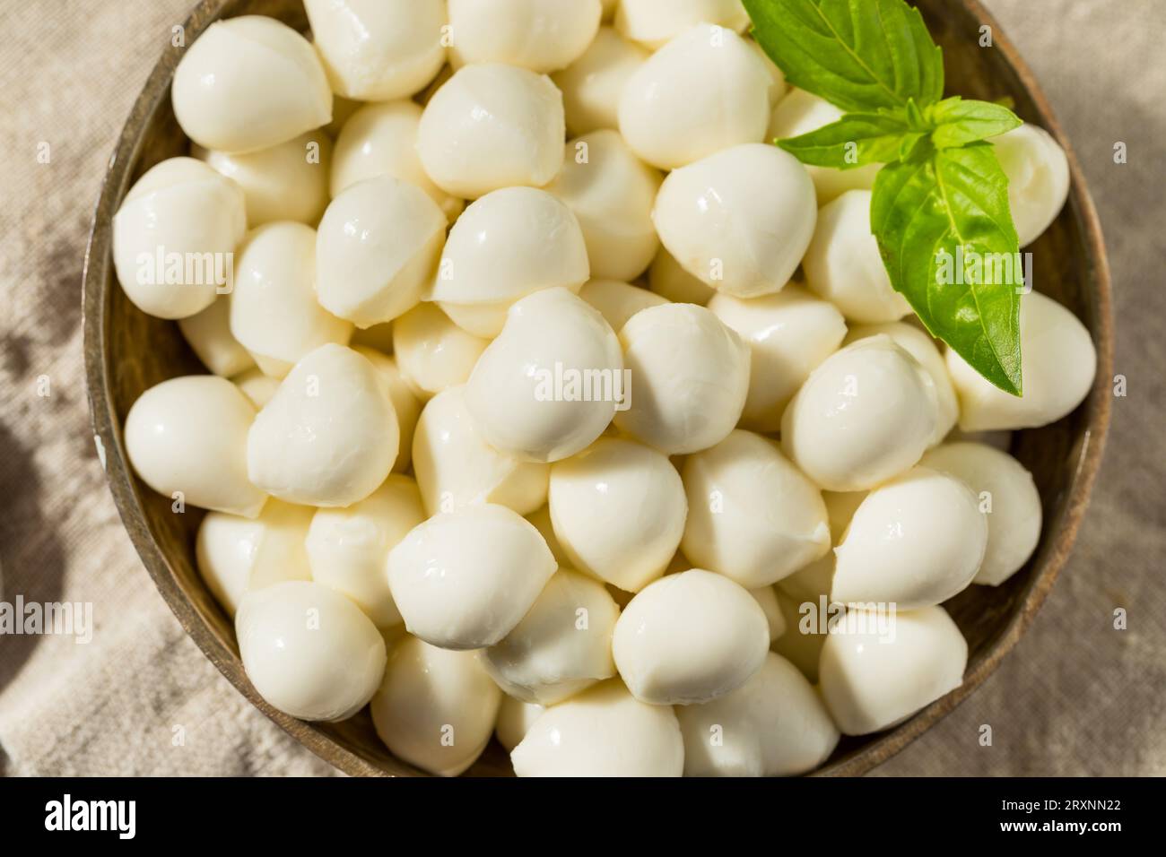 Healthy Raw Organic Mozzarella Pearls with Basil Stock Photo - Alamy
