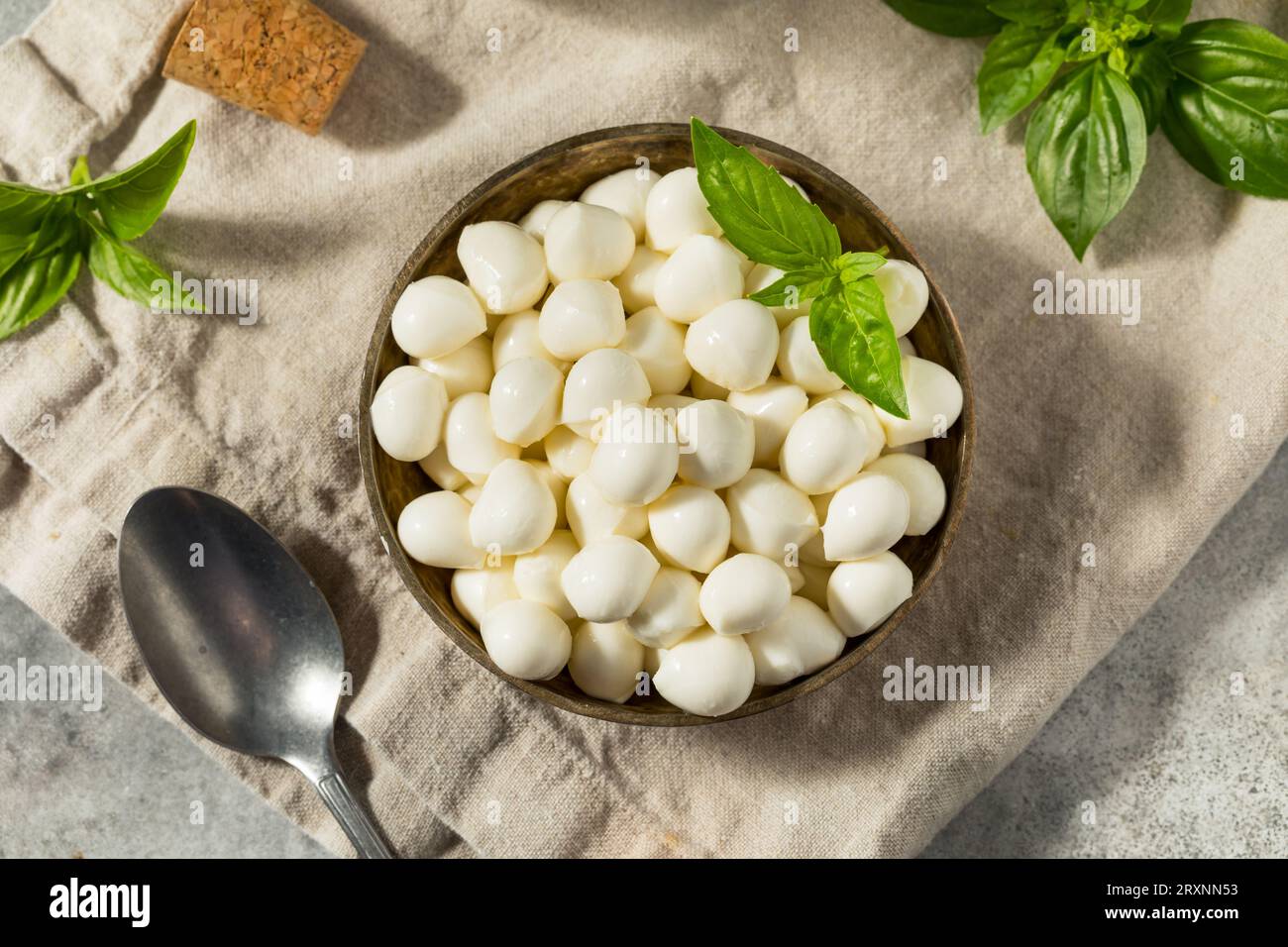 Healthy Raw Organic Mozzarella Pearls with Basil Stock Photo - Alamy