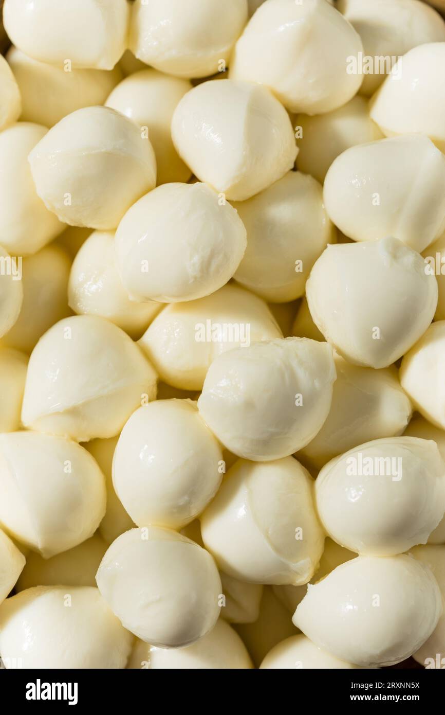 Healthy Raw Organic Mozzarella Pearls with Basil Stock Photo - Alamy