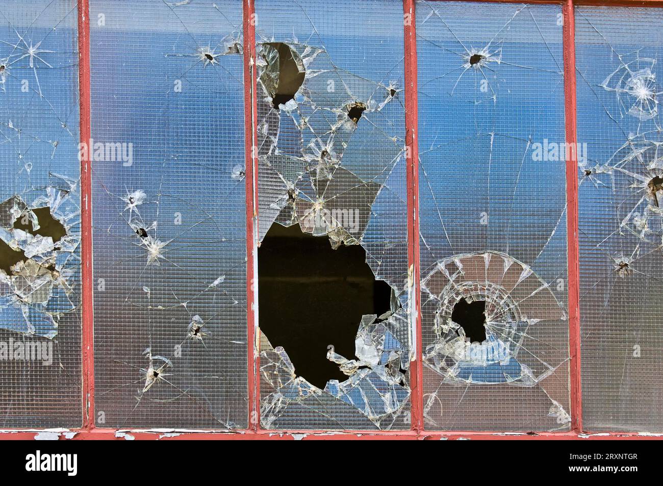 Destroyed window of an industrial ruin Stock Photo - Alamy