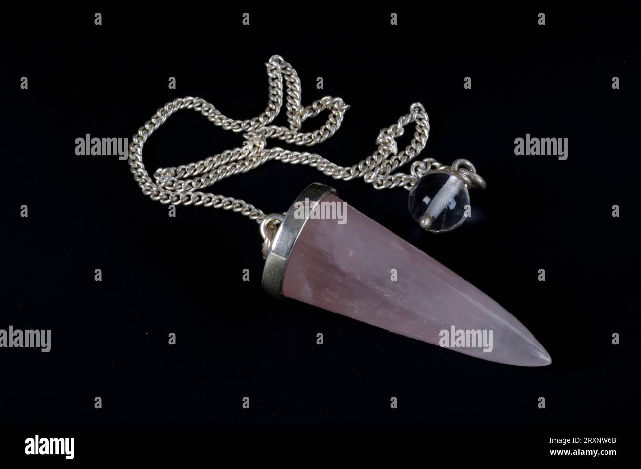 Rose quartz pendulum Stock Photo - Alamy