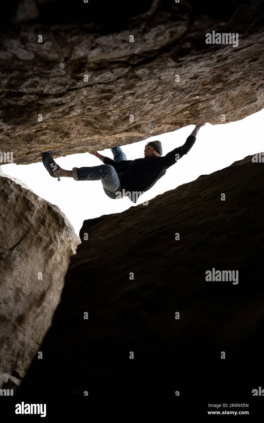 Man bouldering climbing on Portland, Dorset, UK Stock Photo - Alamy