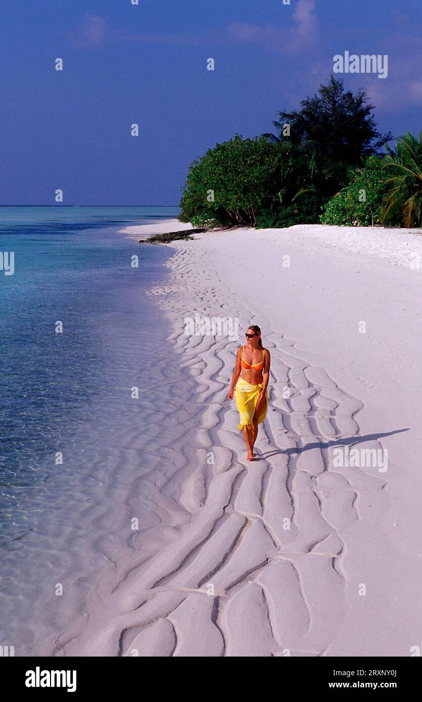 Holidaymakers on the beach, White Sands Resort, Ari atol, Indian Ocean ...