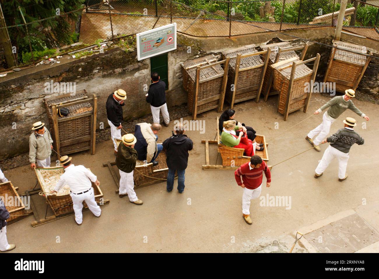 Men pulling basket sleighs with tourists, Monte, Madeira, Portugal, Men ...