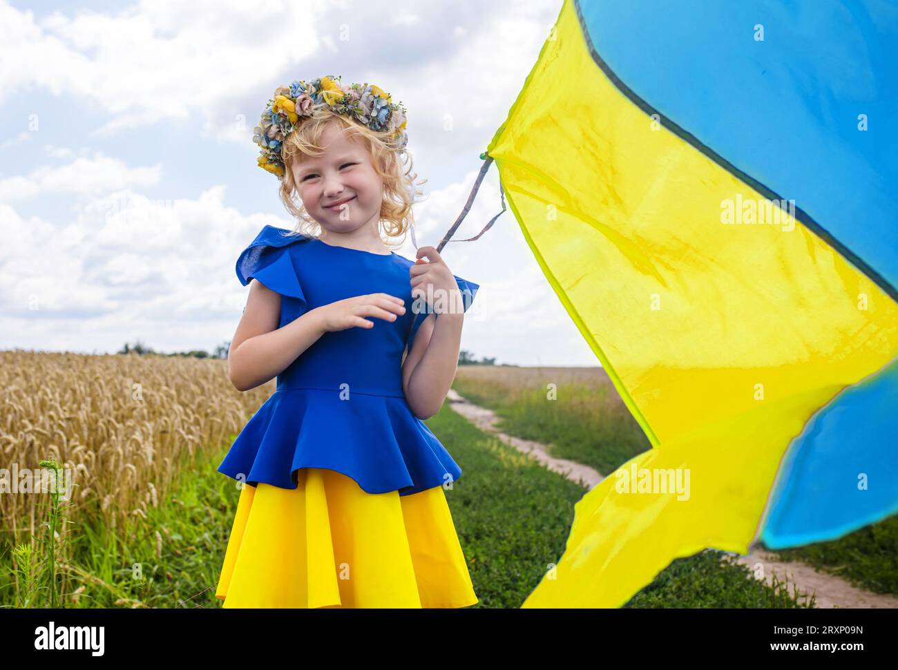 Joyful Ukrainian child proudly displaying the national flag Stock Photo ...