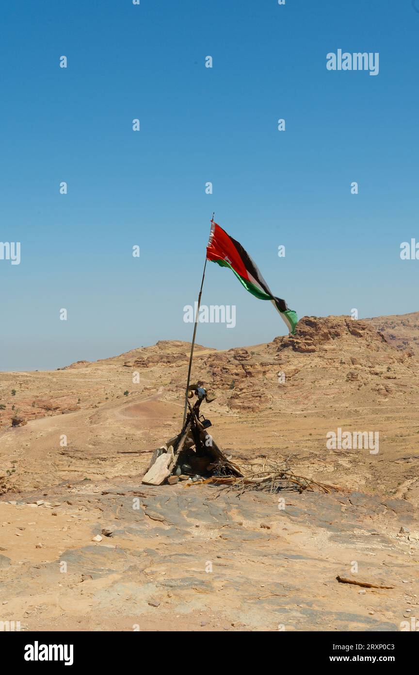 Jordan's flag on makeshift flagpole with an animal skull on it's base ...