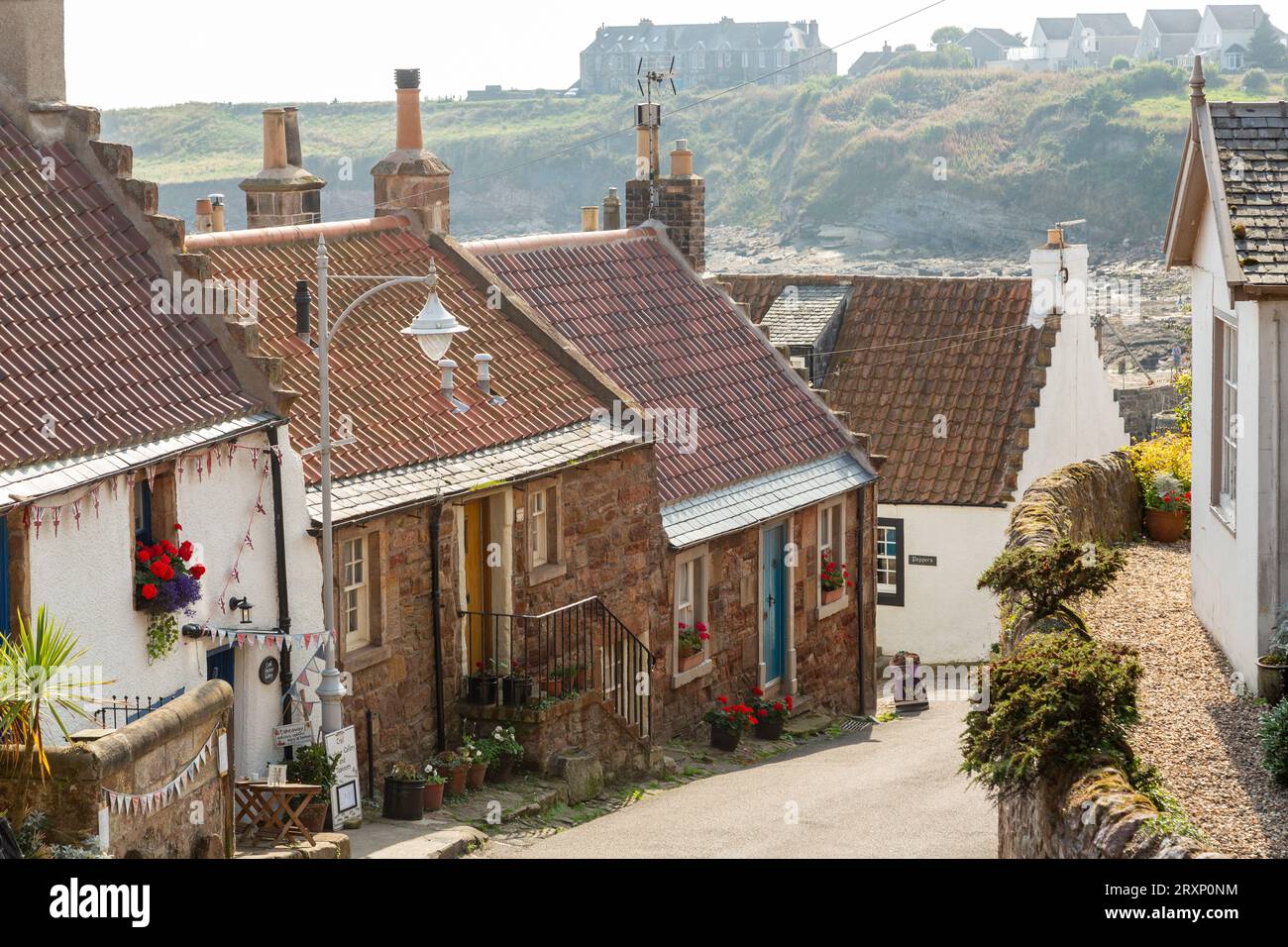Road down to the harbour in the picturesque fishing village of Crail ...