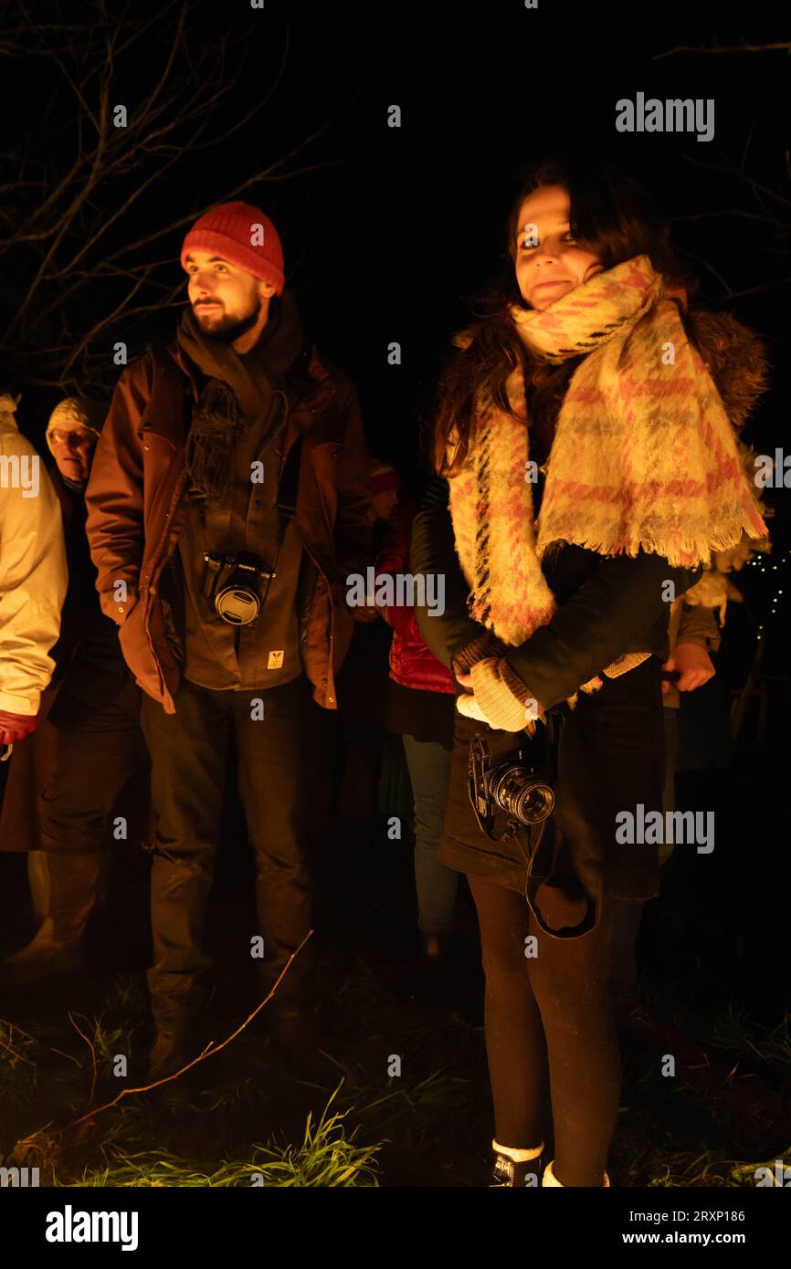 Traditional wassailing ceremony participants with pots and pans in ...