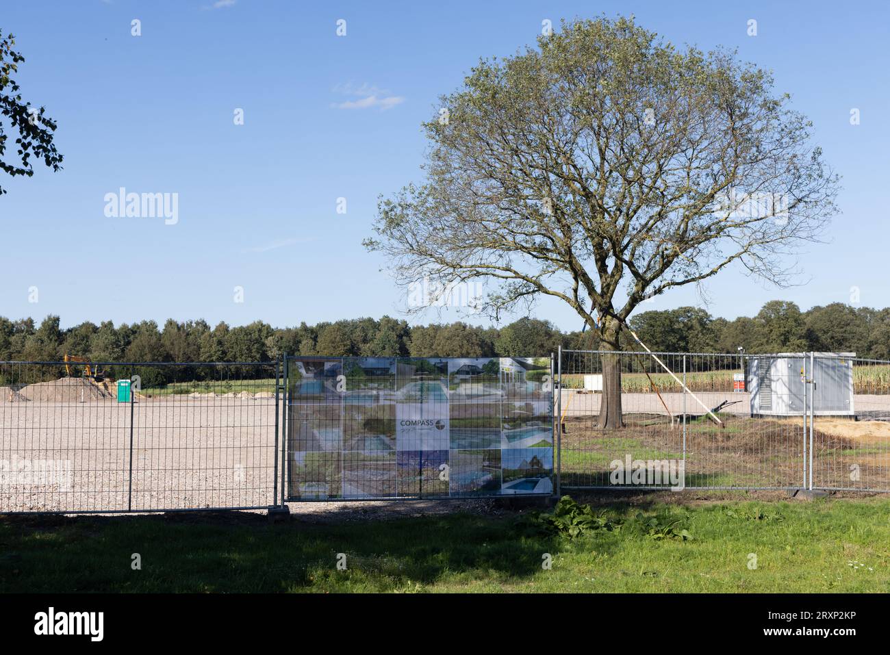 Commercial banner on a fence of Compass, a manufacturer of prefab pools ...