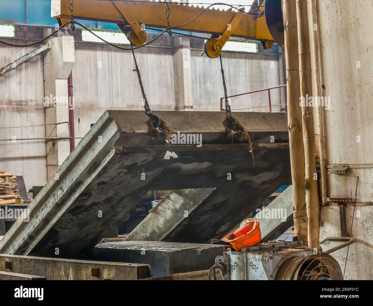Precast concrete part is lifted out of formwork in an automated ...