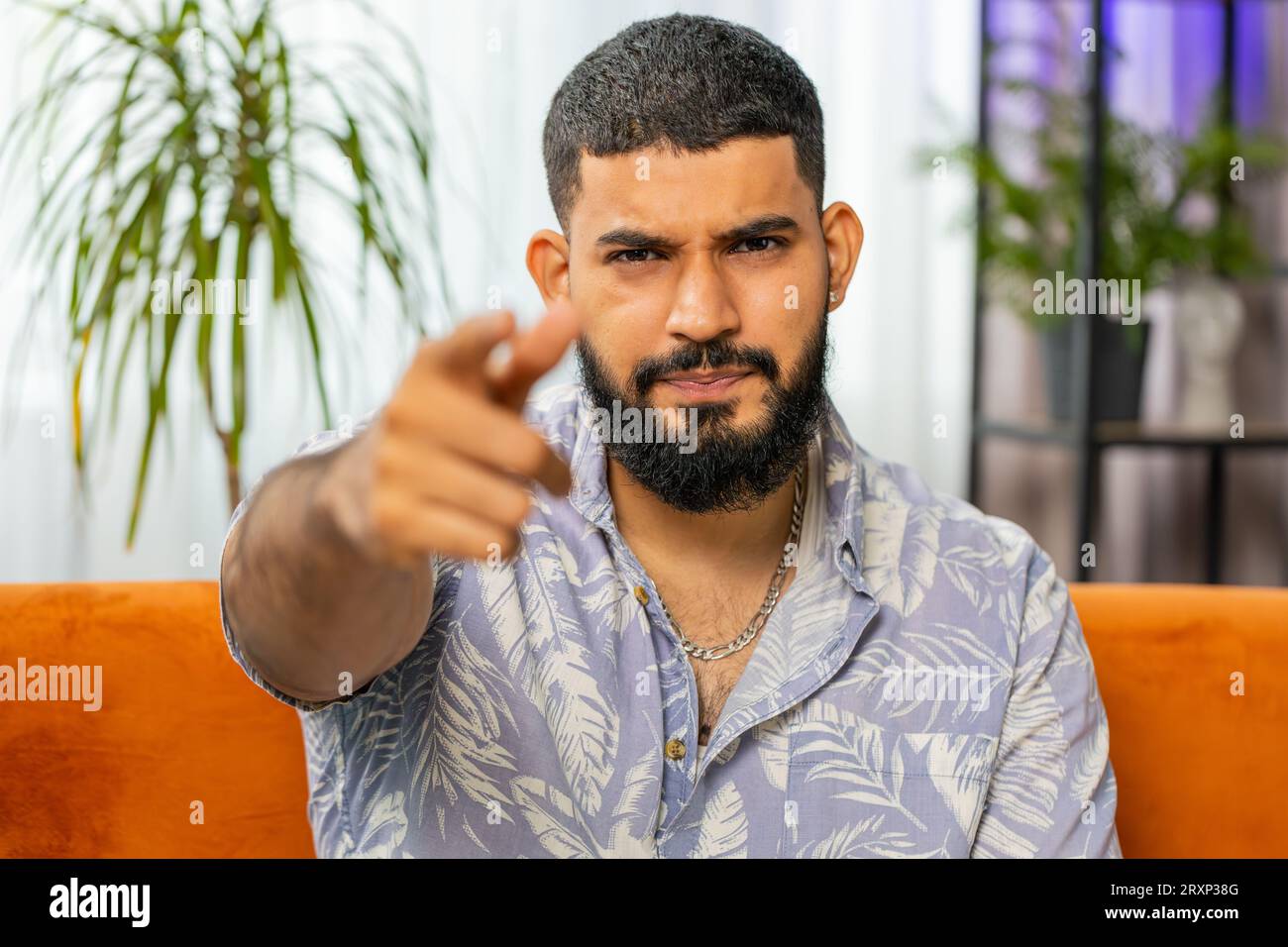 Hey you. Strict unhappy Indian man pointing hand finger to camera ...