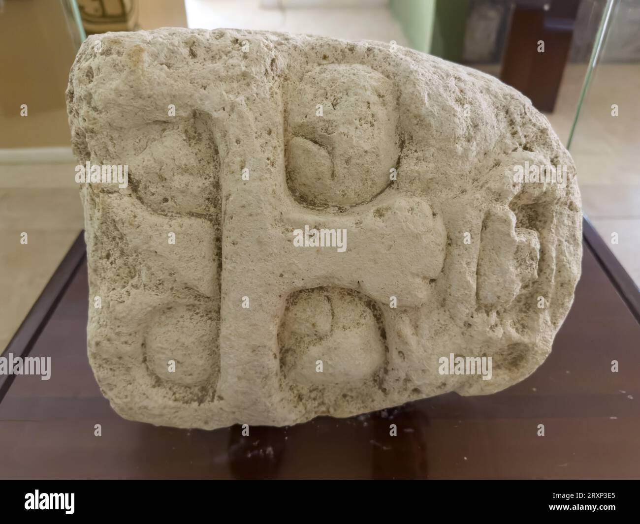 A carved limestone sculpture of Kinich Ahau, the Mayan sun god, in the ...