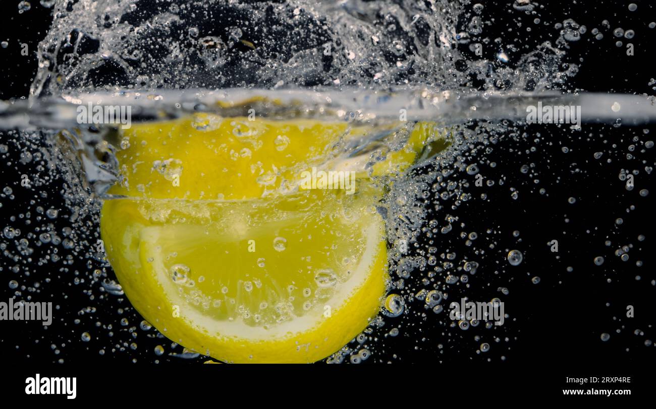 Underwater of freshly squeezed sweetened lemonade which raw lemons ...