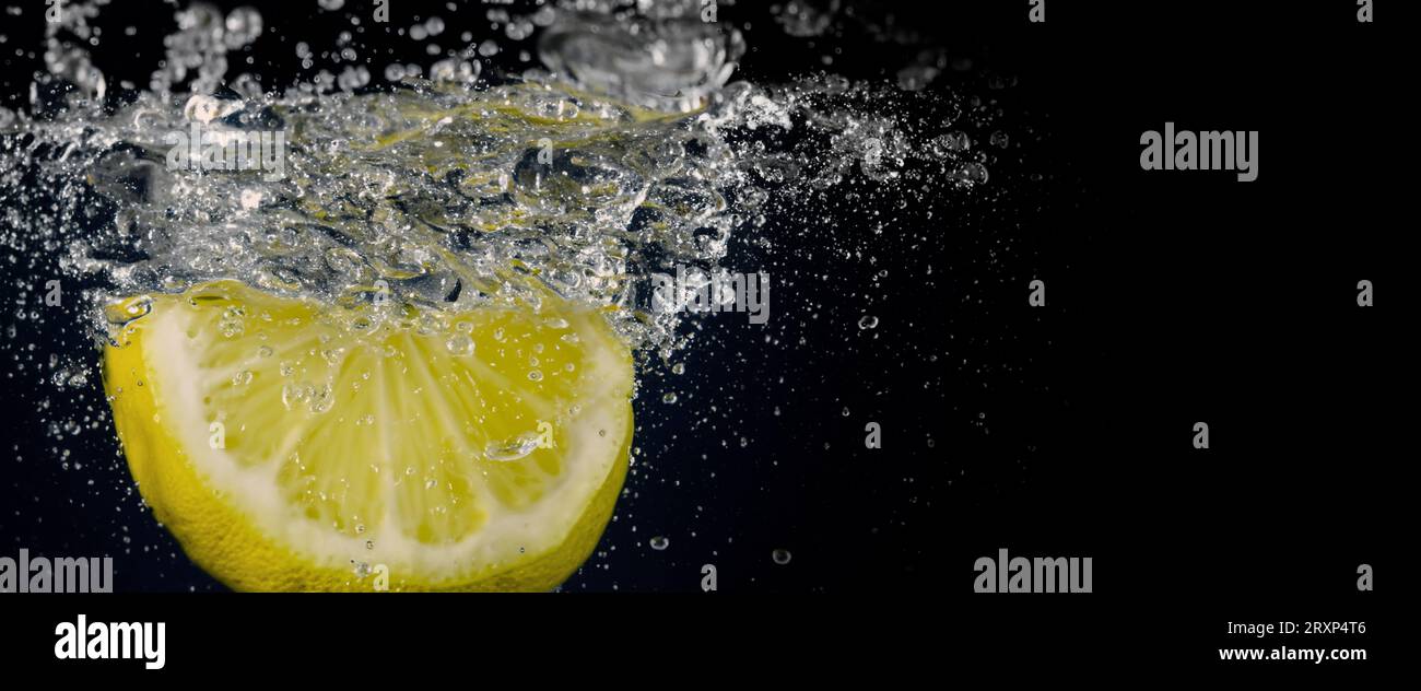 Underwater of freshly squeezed sweetened lemonade which raw lemons ...