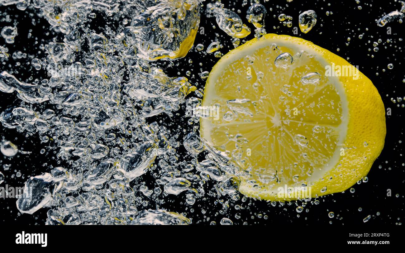 Underwater of freshly squeezed sweetened lemonade which raw lemons ...