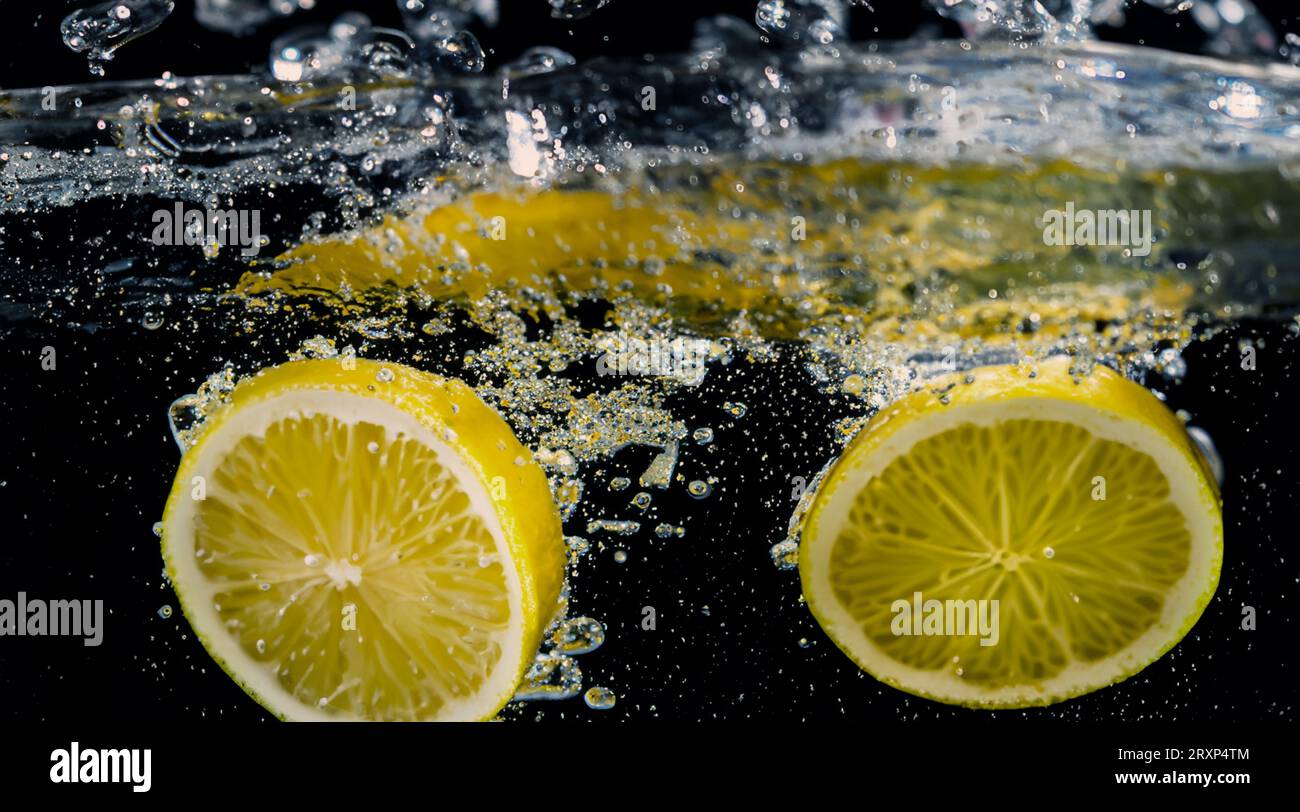 Underwater of freshly squeezed sweetened lemonade which raw lemons ...