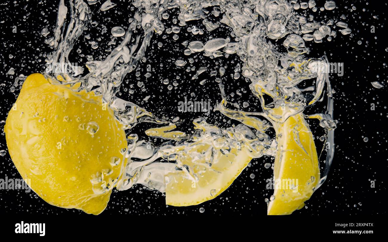 Underwater of freshly squeezed sweetened lemonade which raw lemons ...