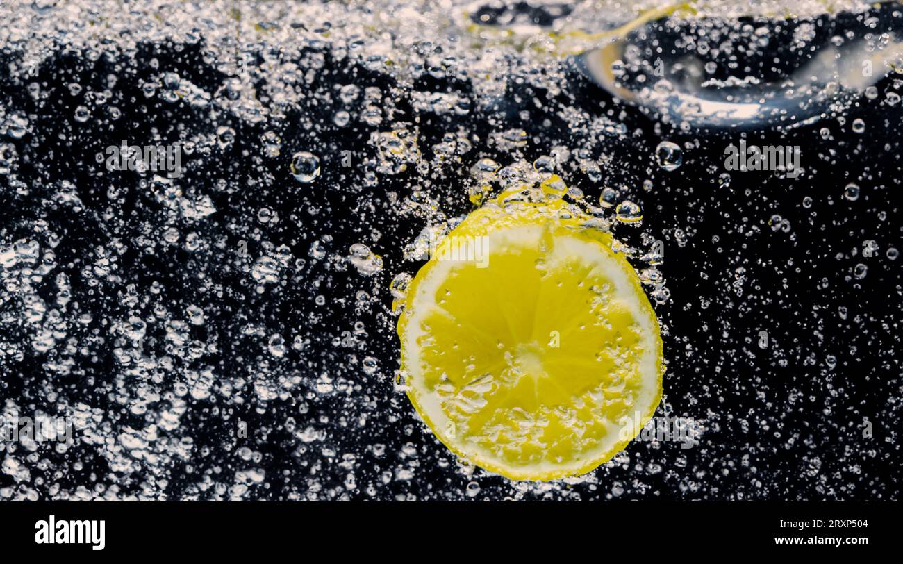 Underwater of freshly squeezed sweetened lemonade which raw lemons ...